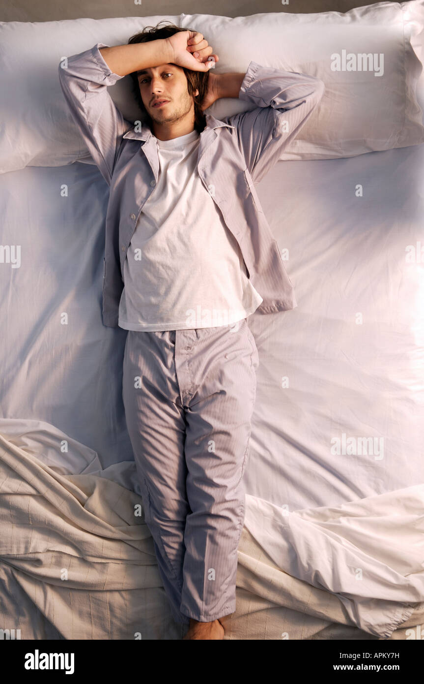 Man in bed Stock Photo - Alamy