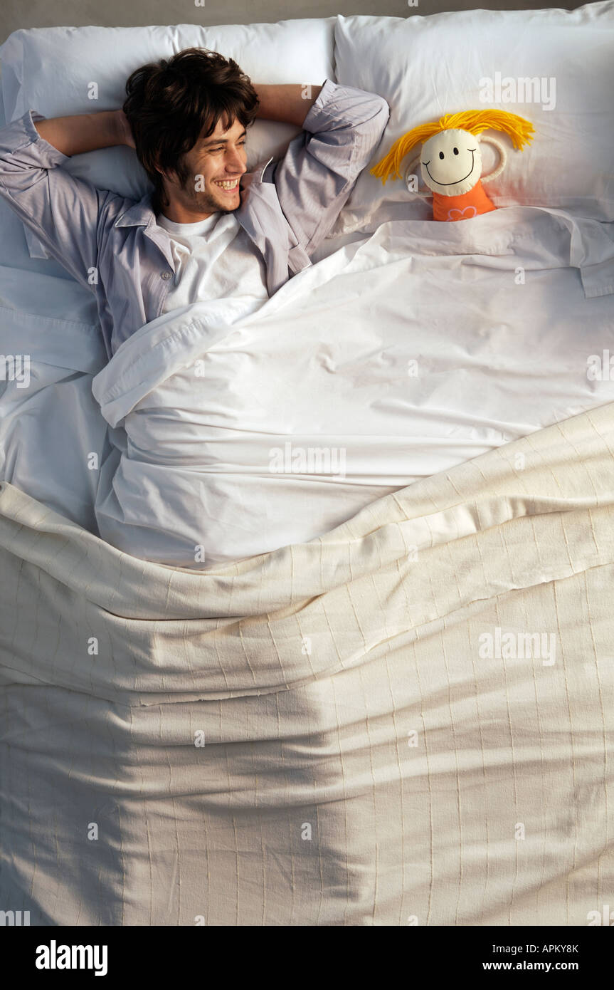 Man in bed Stock Photo - Alamy
