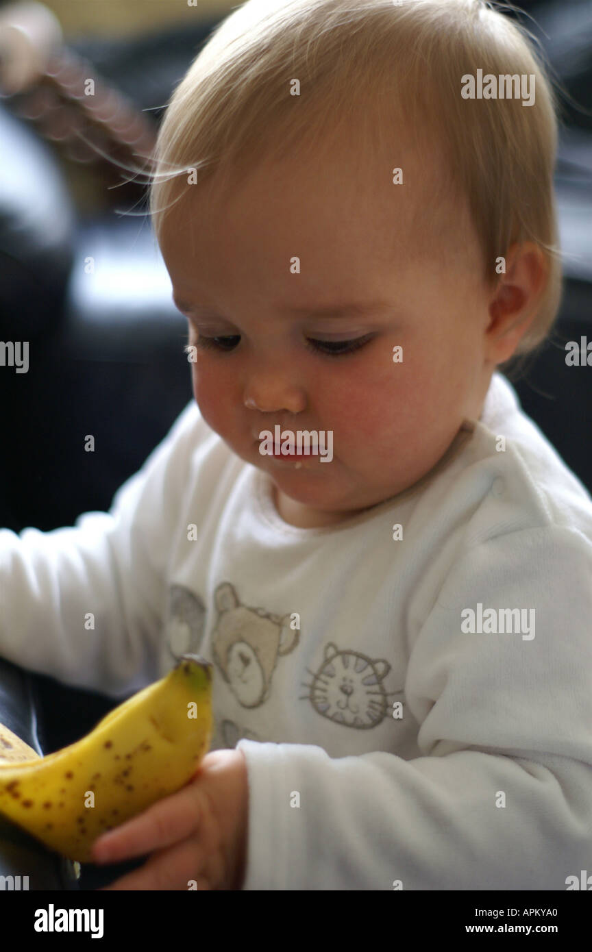Beautiful Baby Esme Eating a Banana Stock Photo - Alamy