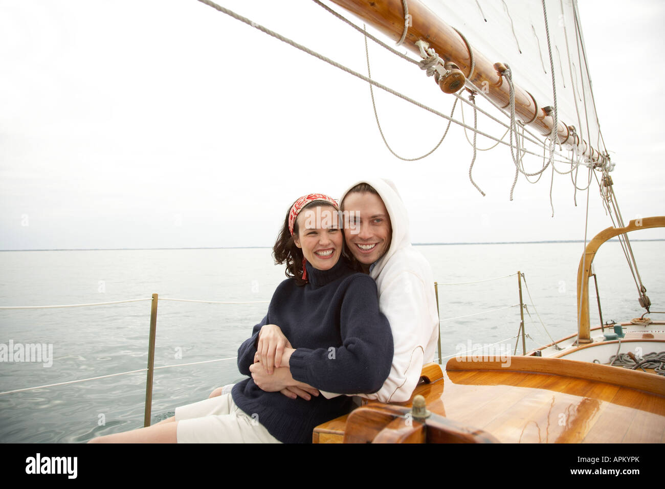 Young couple hugging in sailing boat Stock Photo - Alamy