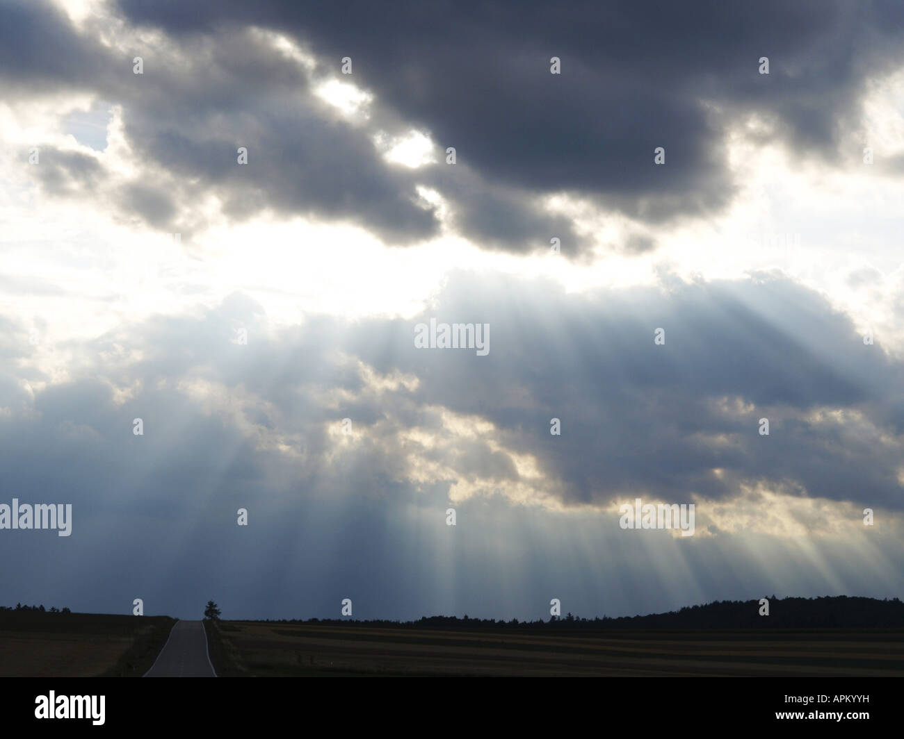 sunbeams in stormy atmosphere over cultural landscape , Austria, Lower ...