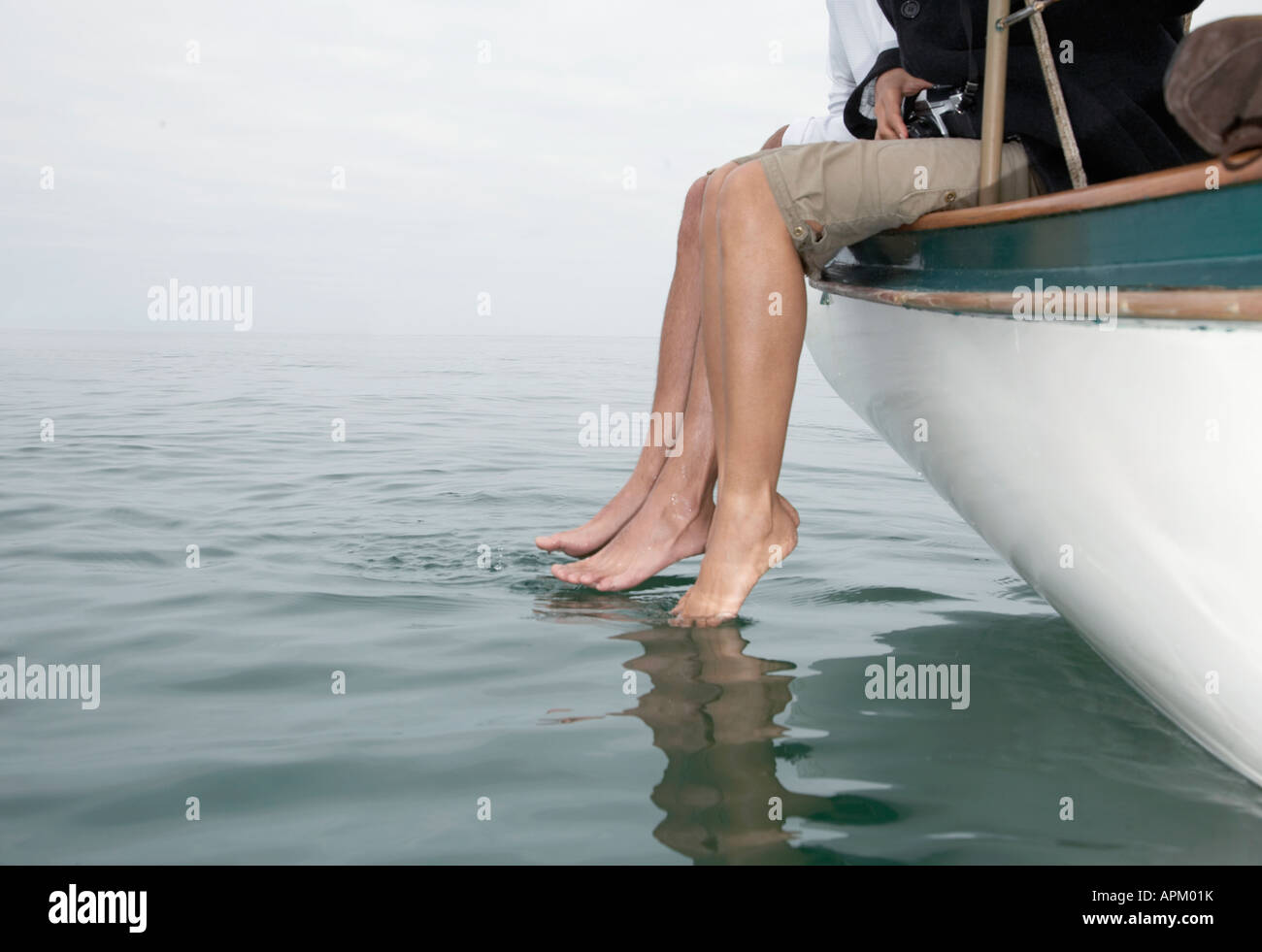 Feet in two boats hi-res stock photography and images - Alamy