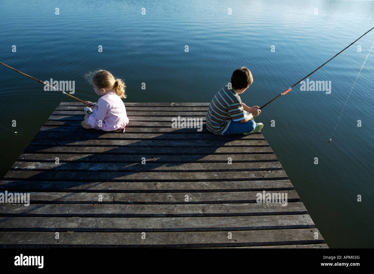 Two little girls fishing hi-res stock photography and images - Alamy