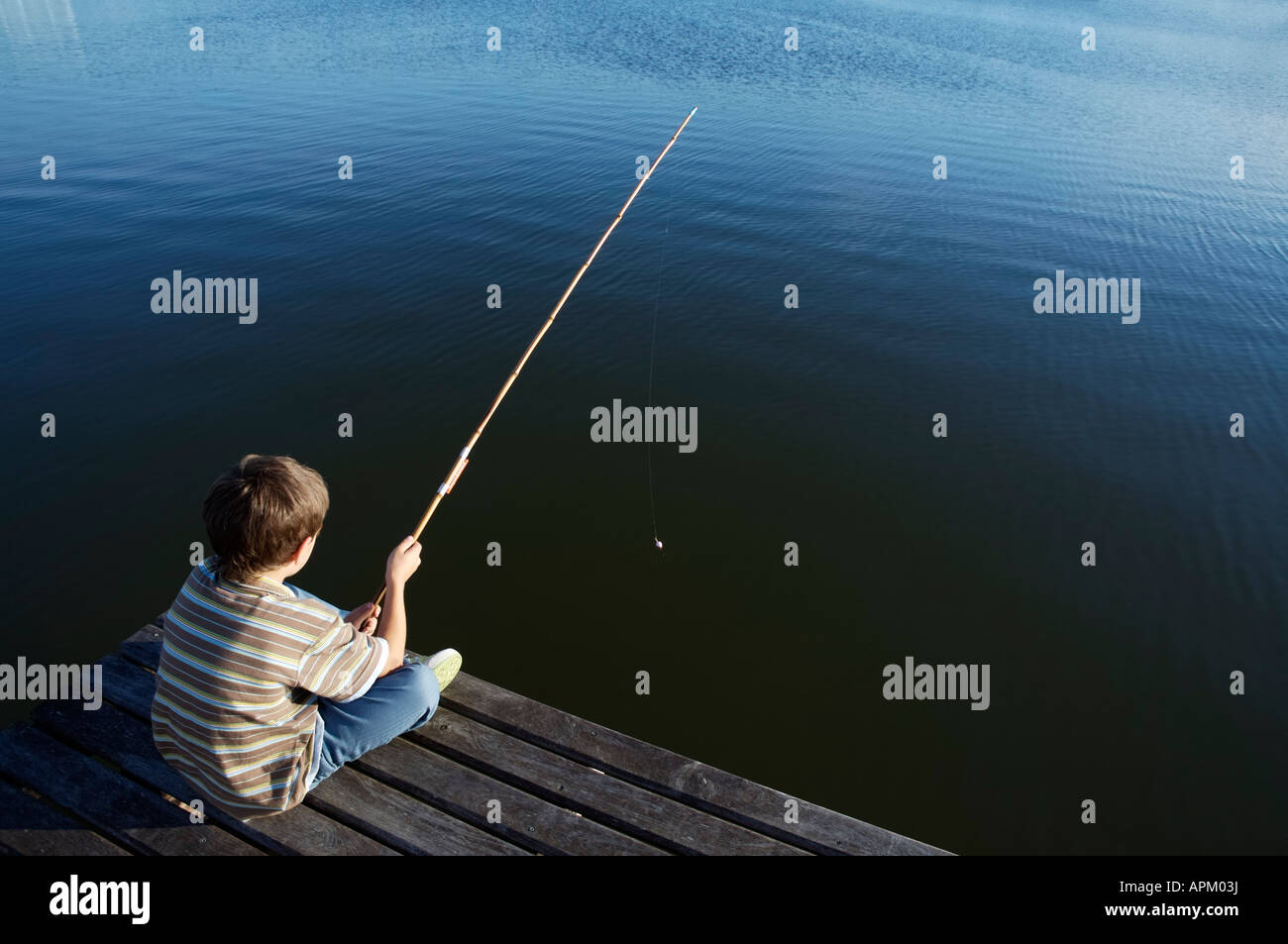 Little boy fishing Stock Photo - Alamy