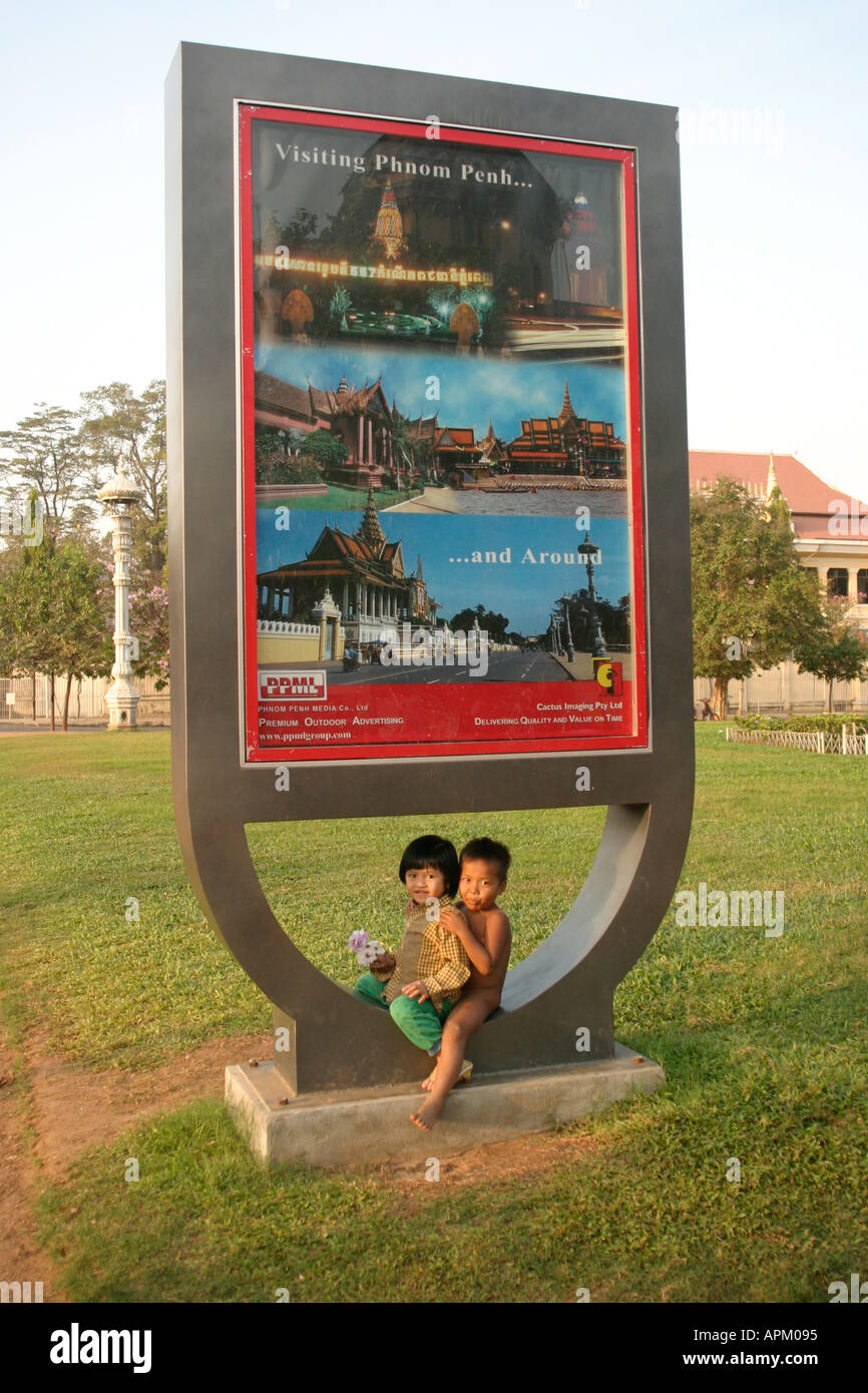 two kids under city sign for phnom phen cambodia Stock Photo - Alamy