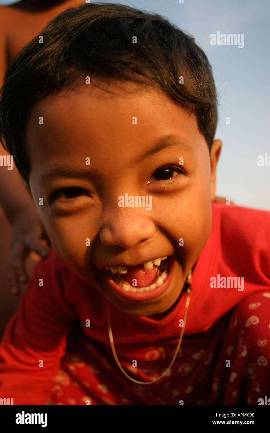Boy shouts and laughs at camera Stock Photo - Alamy