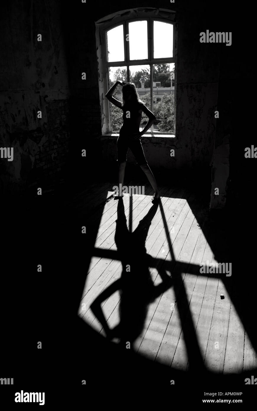 silhouette and shadow of a womans body in front of a window Stock Photo ...