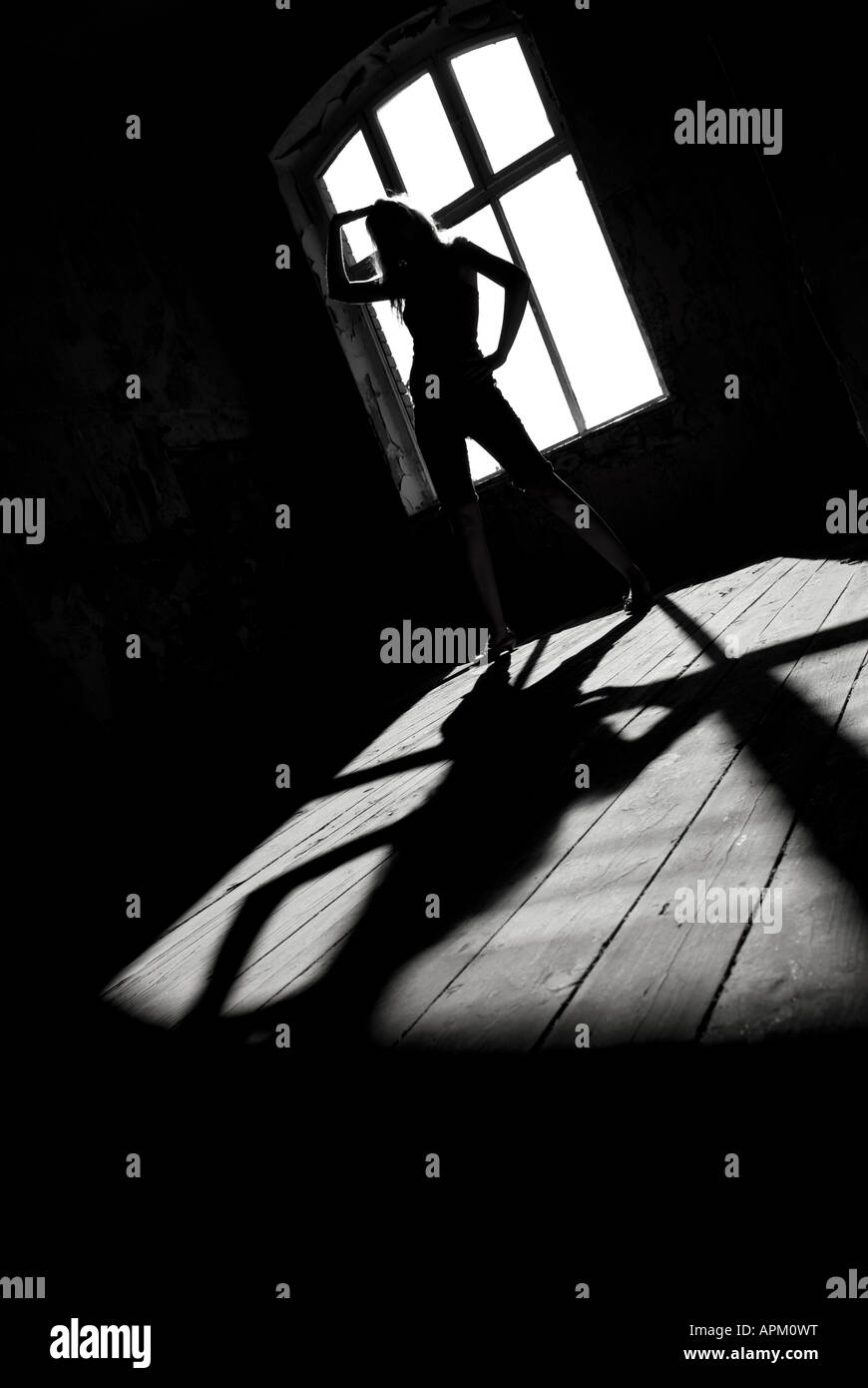 silhouette and shadow of a womans body in front of a window Stock Photo ...