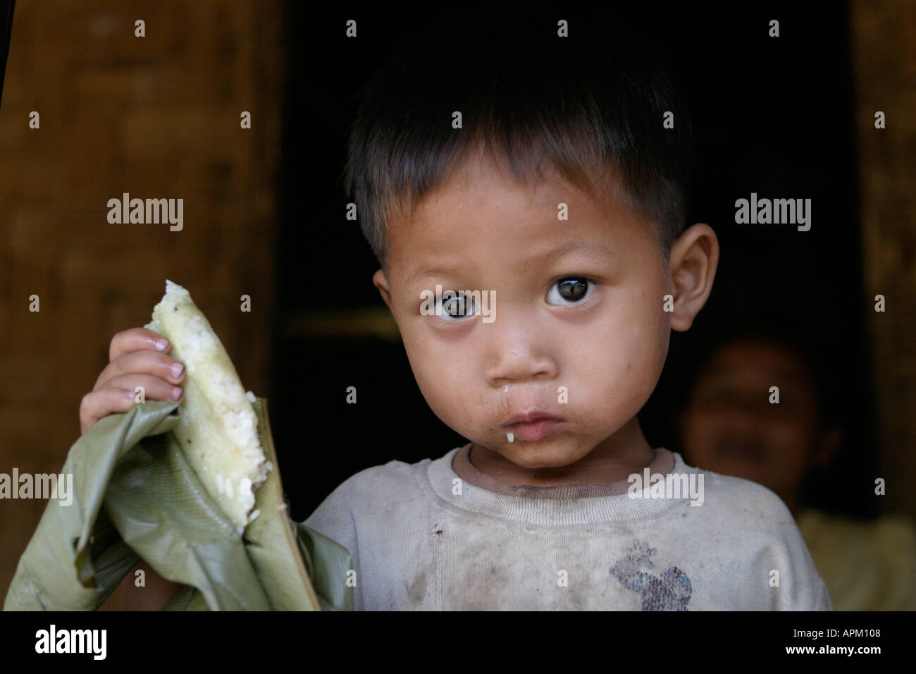 young boy eating sticky rice Stock Photo - Alamy