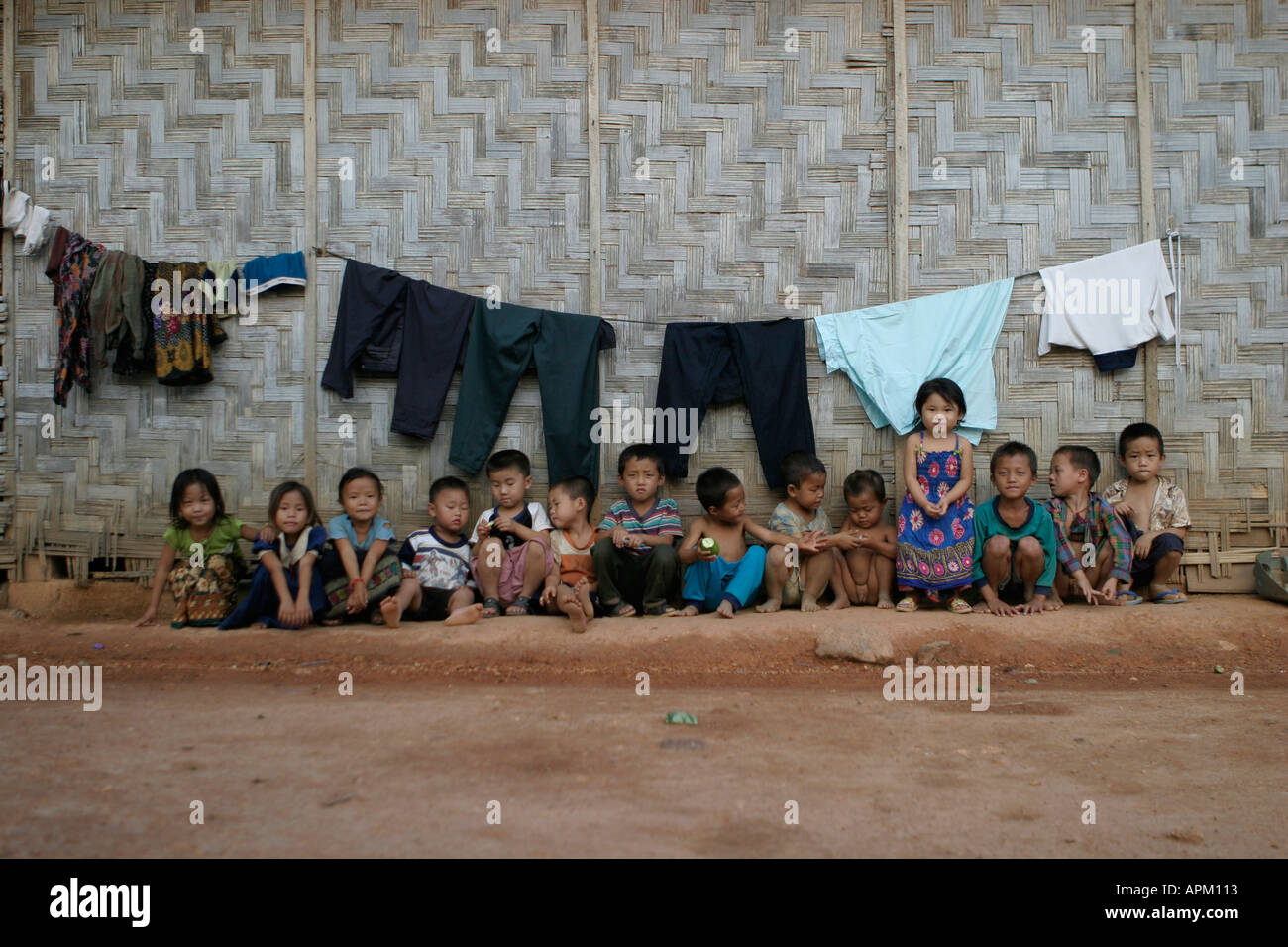 group of children under washing line Stock Photo - Alamy