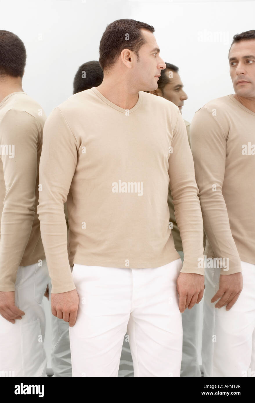 Man standing by mirrors Stock Photo - Alamy