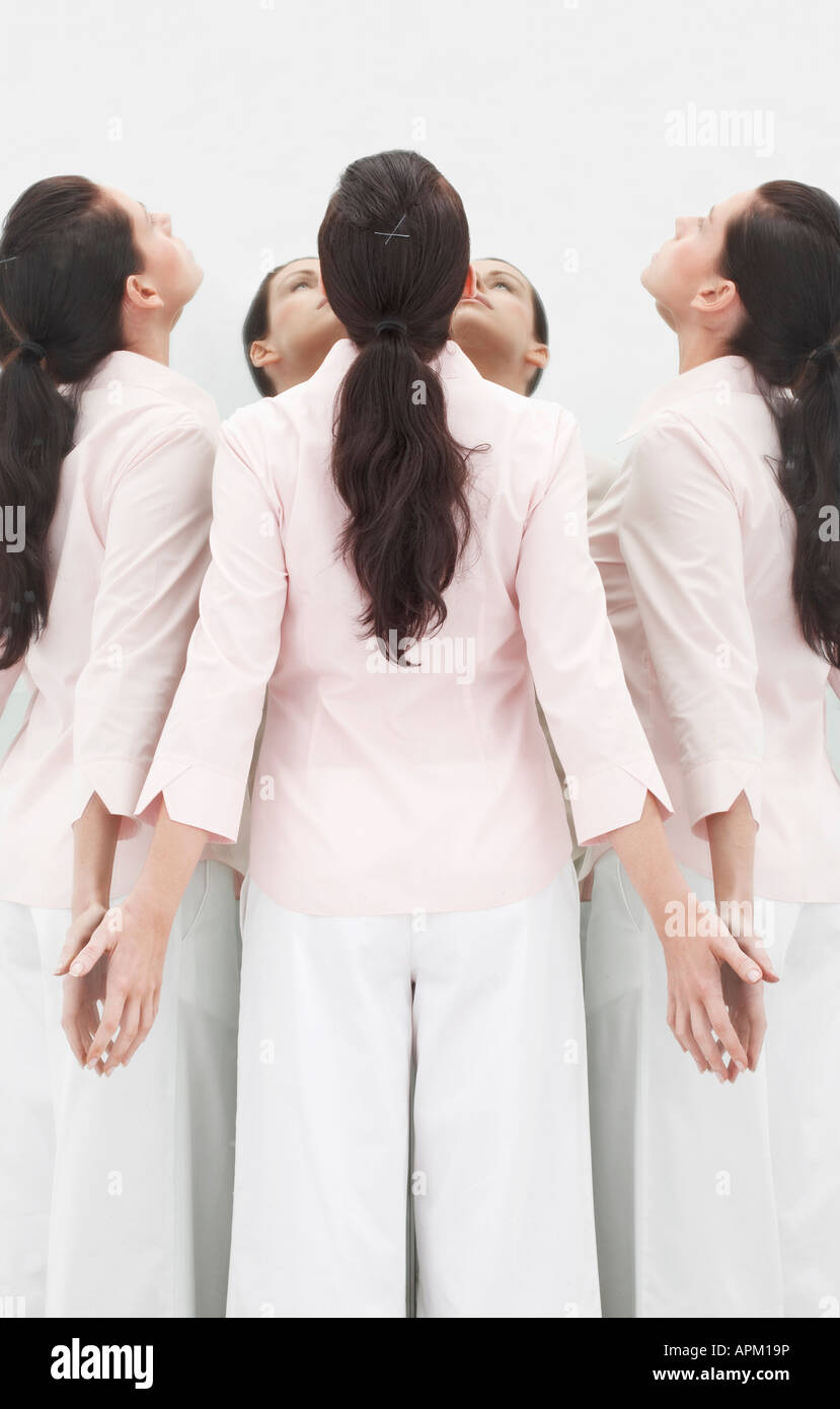 Woman facing mirror, looking up Stock Photo - Alamy