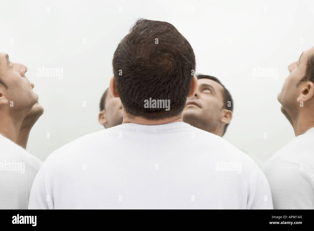 Man facing mirror, looking up Stock Photo - Alamy