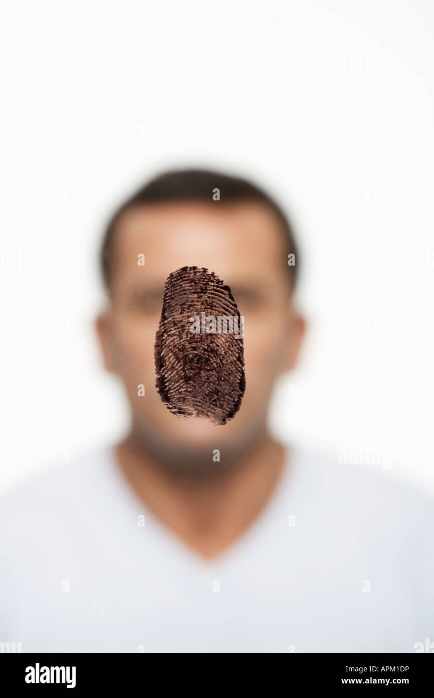 Fingerprint covering man's face Stock Photo - Alamy