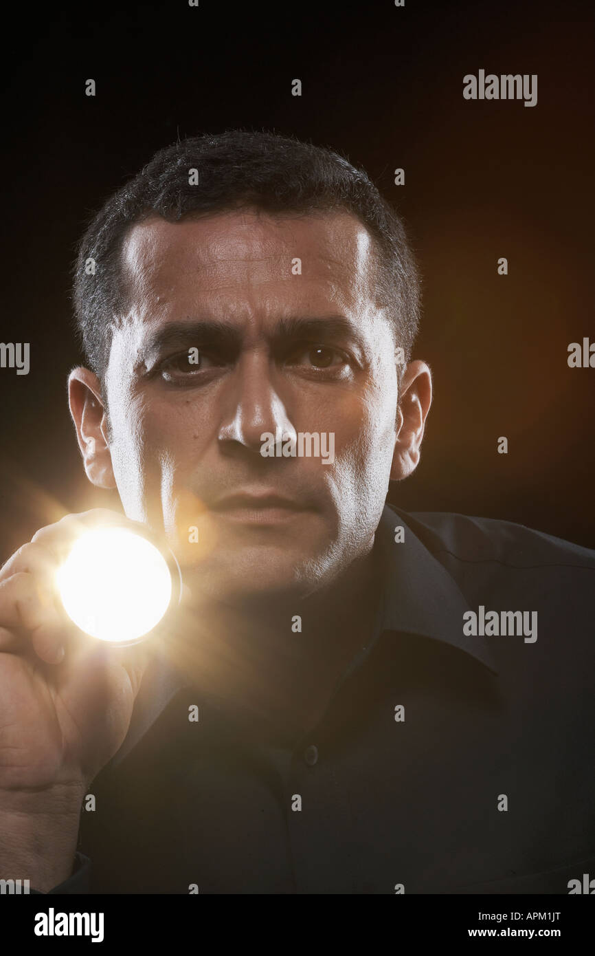 Man holding torch, lens flare Stock Photo - Alamy