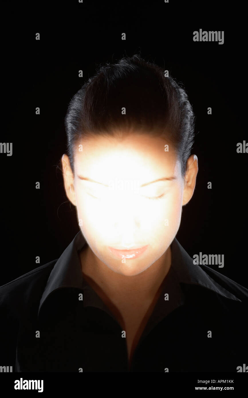 Woman's face in spotlight Stock Photo - Alamy