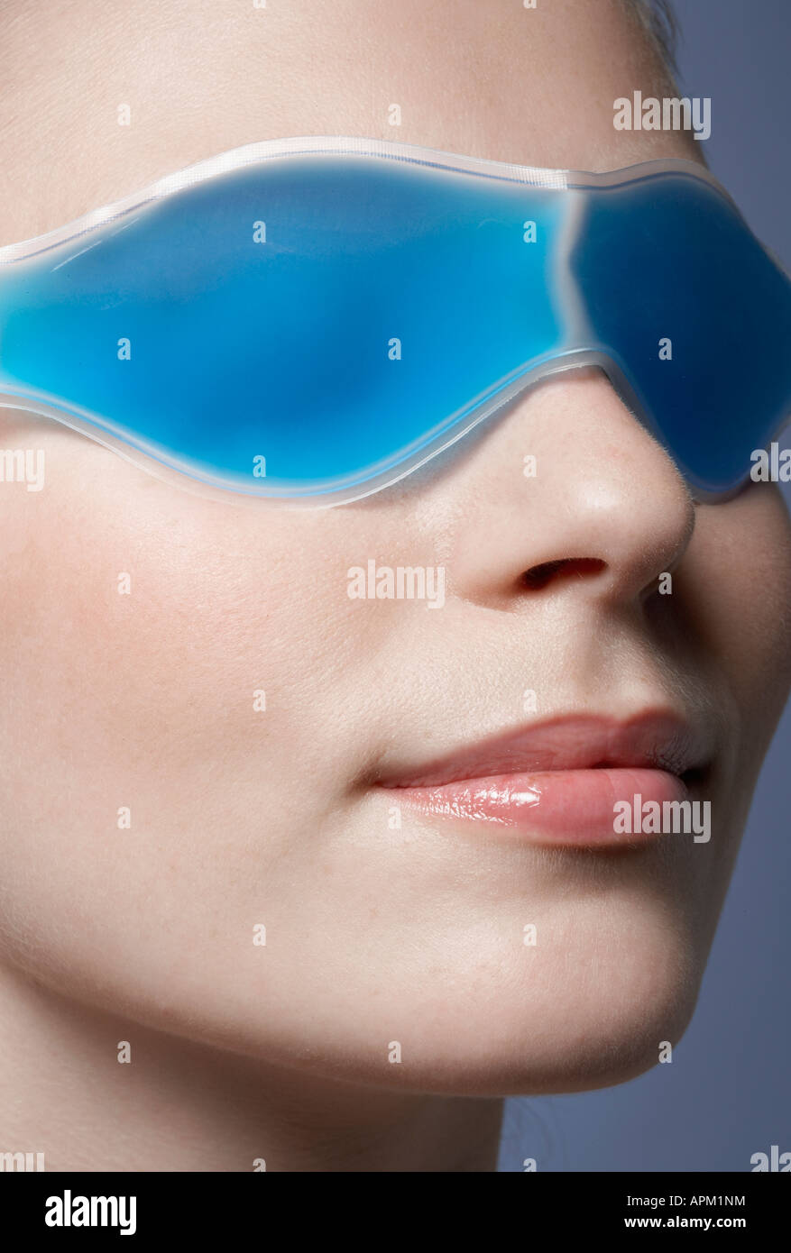 Young woman wearing eye mask Stock Photo - Alamy