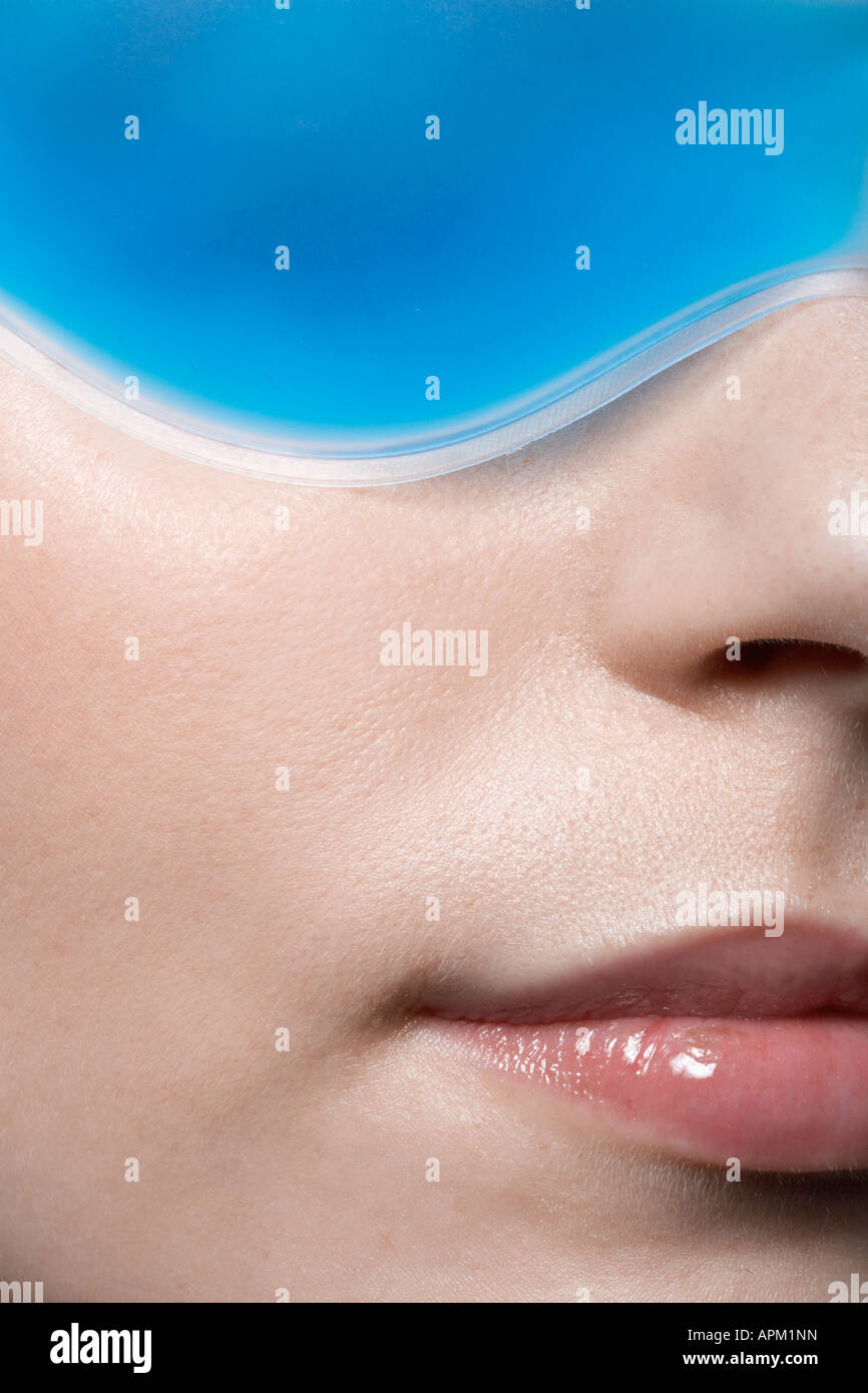 Young woman wearing eye mask, close-up Stock Photo - Alamy