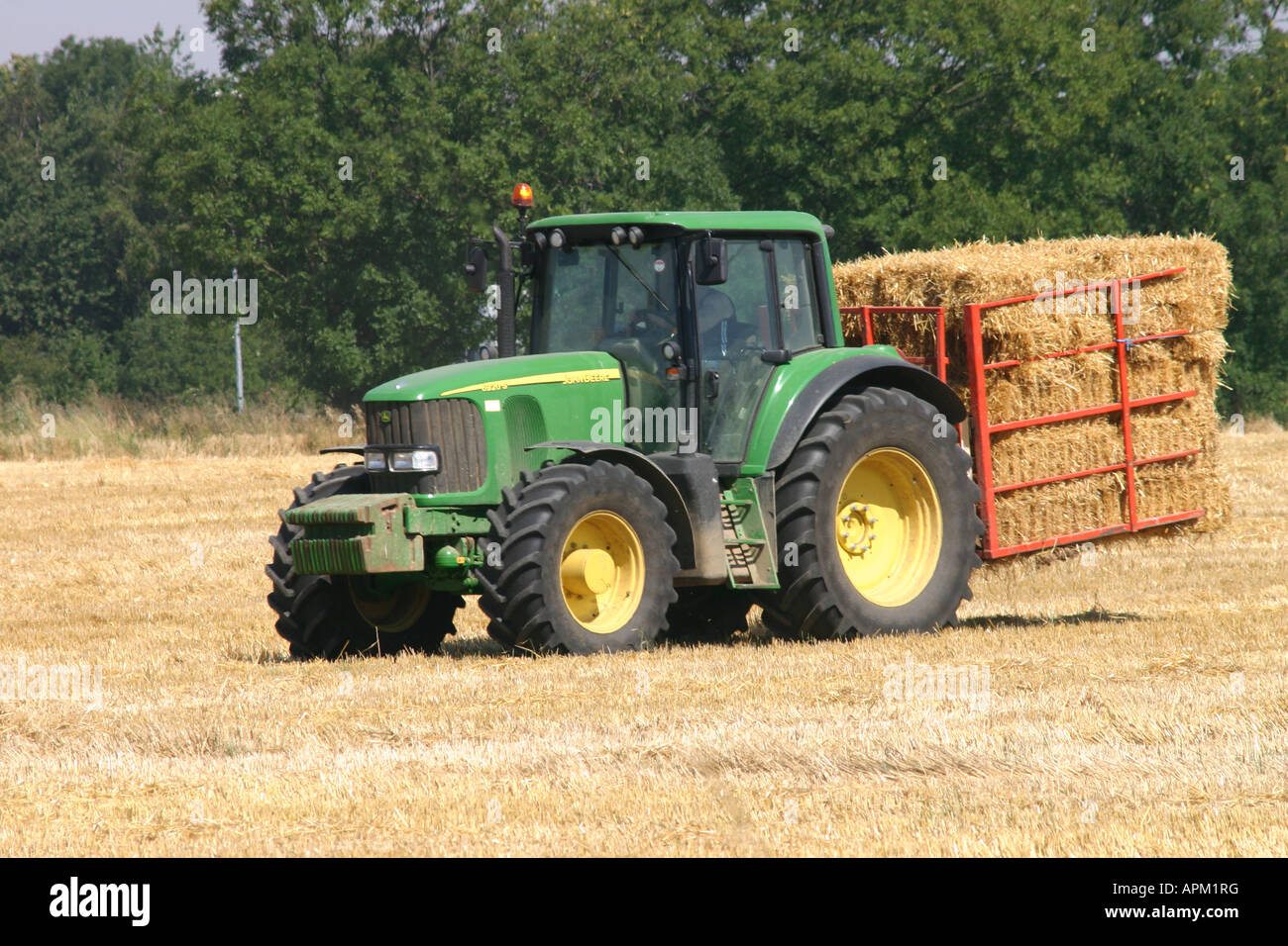 tractor square golden wheat hay bale stubble Stock Photo - Alamy