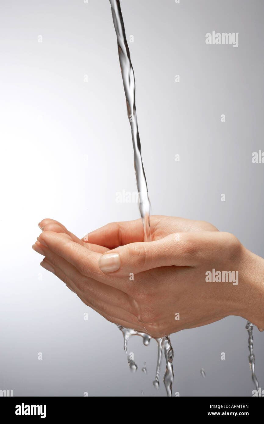Water pouring on hands, close-up Stock Photo - Alamy