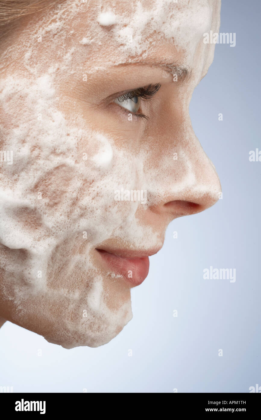 Soap on woman's face, close-up Stock Photo - Alamy
