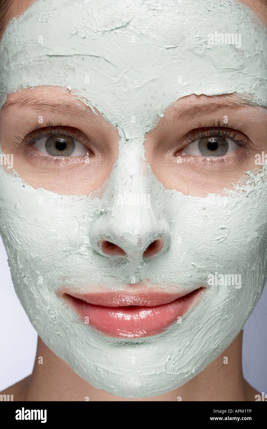 Young woman with face mask, close-up Stock Photo - Alamy