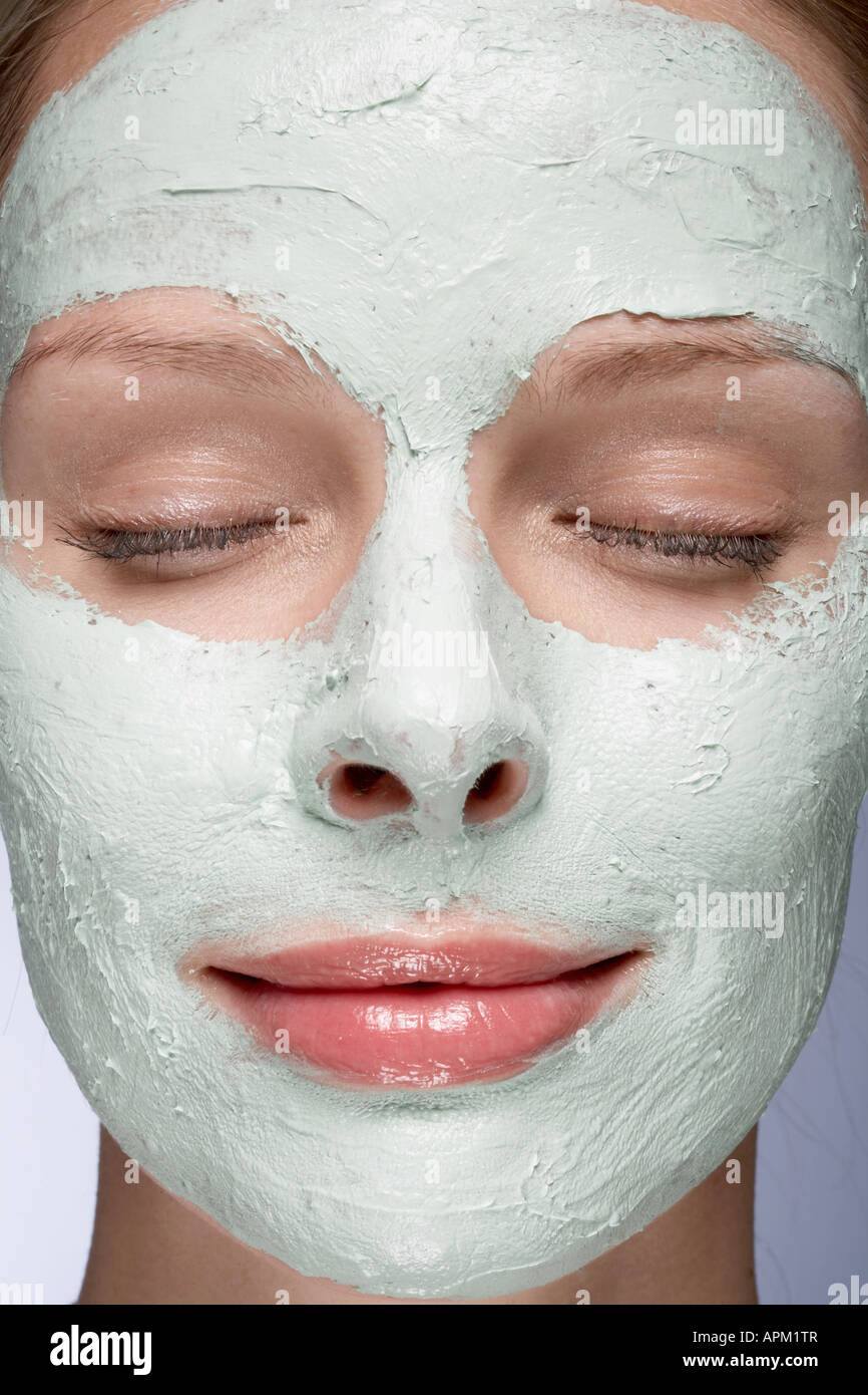 Young woman with face mask, close-up Stock Photo - Alamy