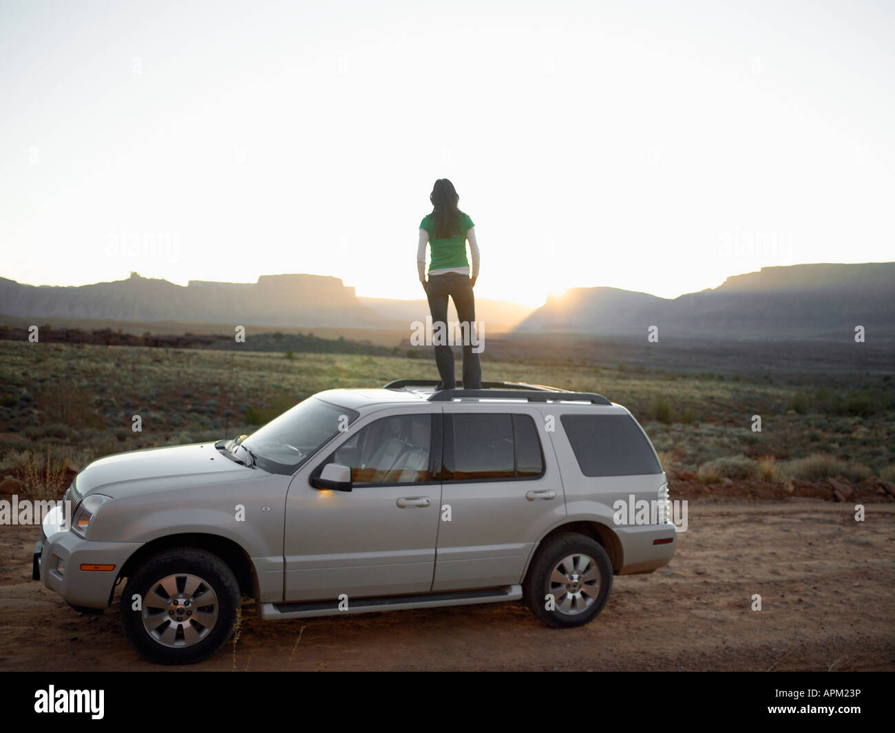 Woman Standing On Roof Car Stock Photos & Woman Standing On Roof Car ...