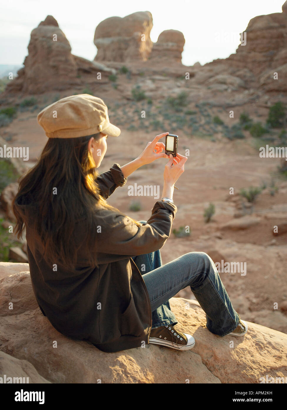 Woman photographing rock formations Stock Photo - Alamy