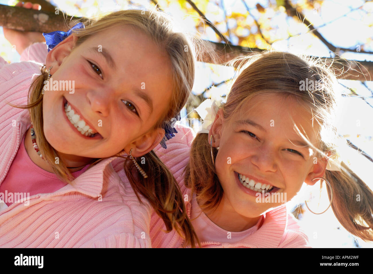 Portrait cute blonde twins smiling hi-res stock photography and images ...