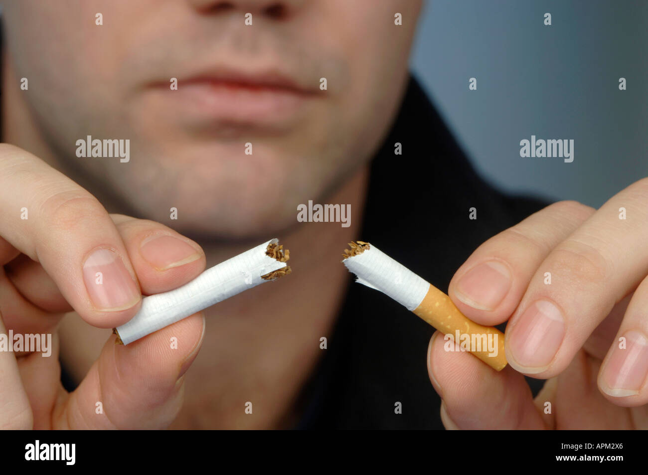 Human hands breaking cigarettes hi-res stock photography and images - Alamy