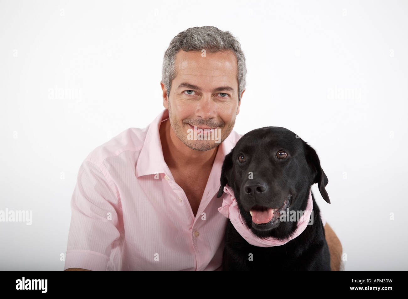 Black Labrador dog and owner Stock Photo - Alamy
