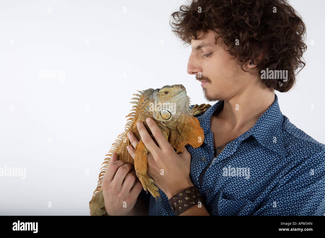 Man with Iguana Stock Photo - Alamy