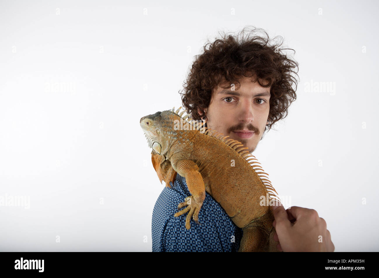 Man with Iguana Stock Photo - Alamy