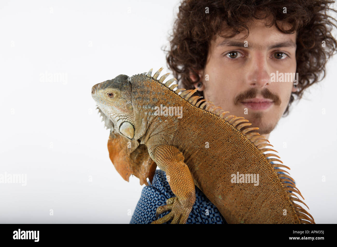 Man with Iguana Stock Photo - Alamy