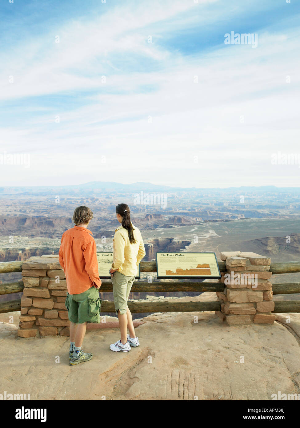 Tourists at observation point, rock strata in background, rear view ...