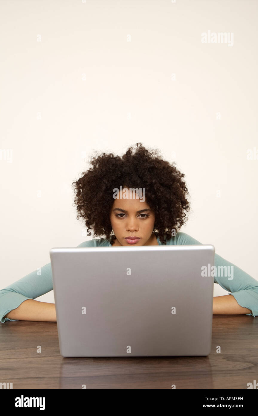 Serious young latin woman using hi-res stock photography and images - Alamy