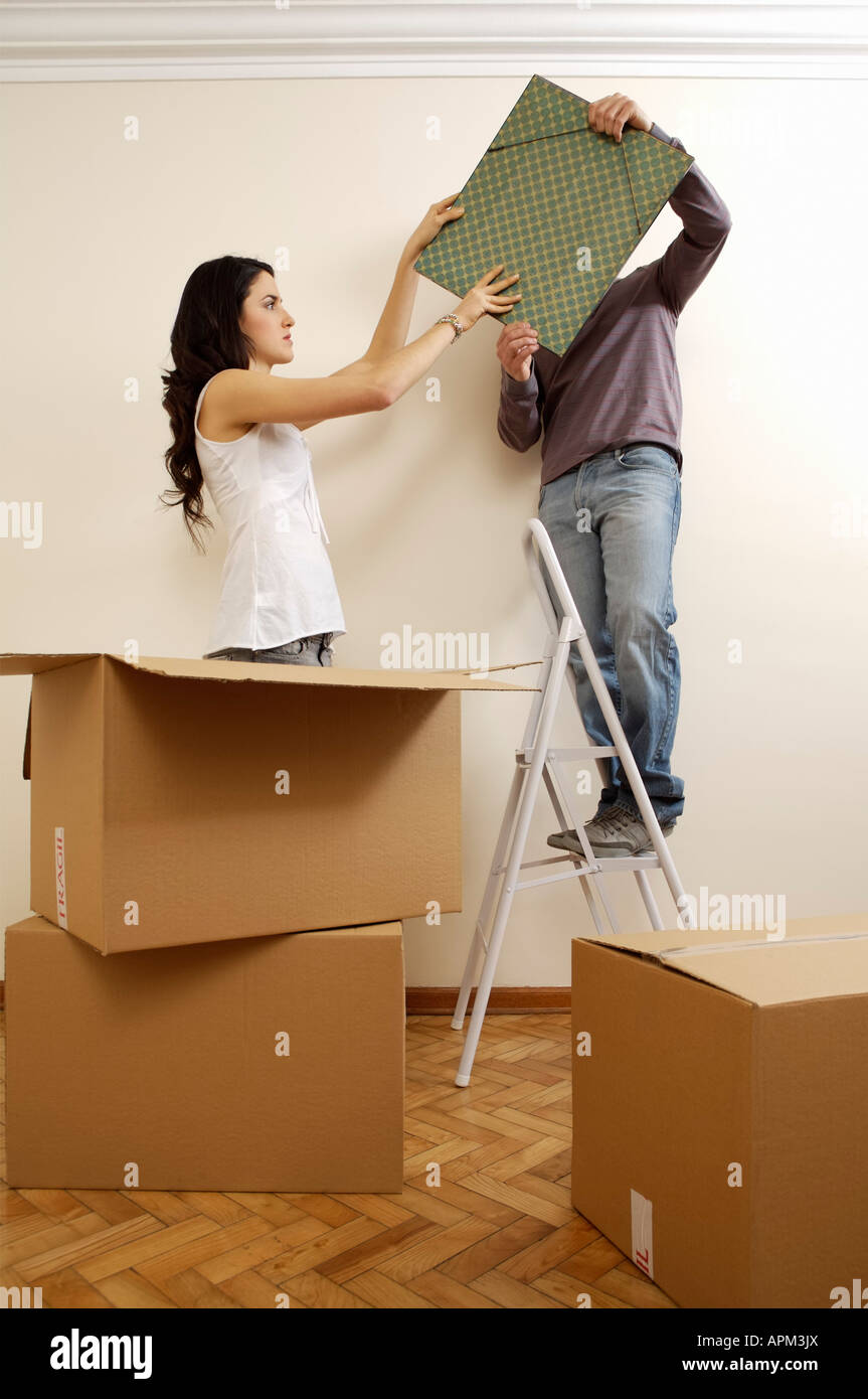 Young couple moving in Stock Photo - Alamy