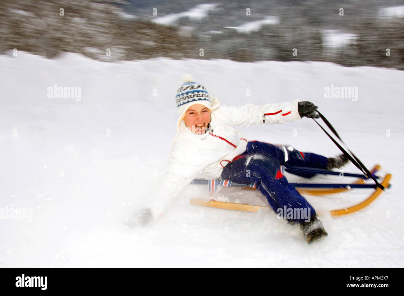 Boy enjoying sledge ride hi-res stock photography and images - Alamy