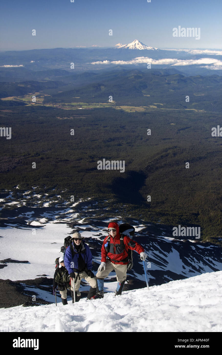 Two men and a woman climbing up snow on Mount Adams Yakima County ...