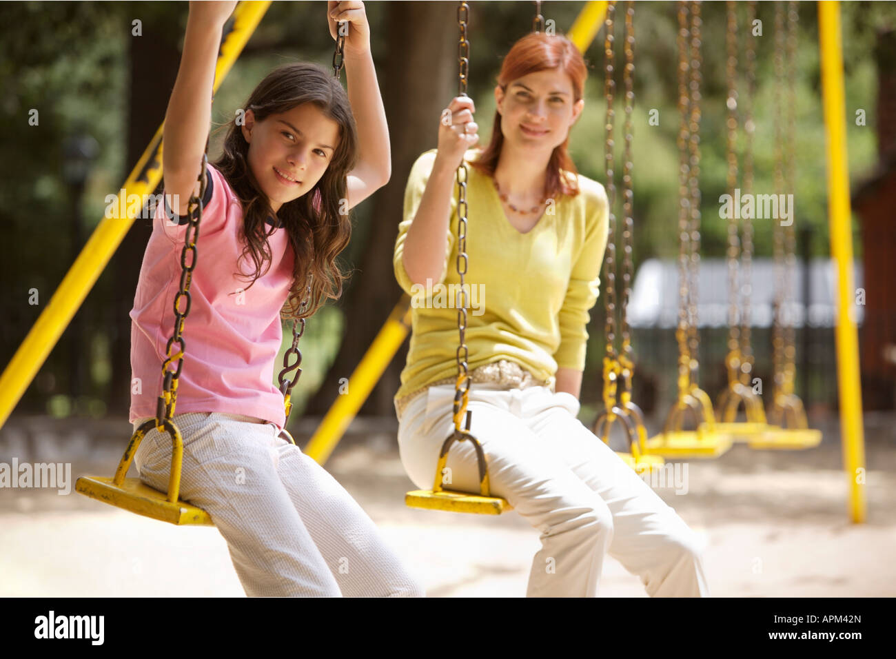 Mother and children in playground Stock Photo - Alamy