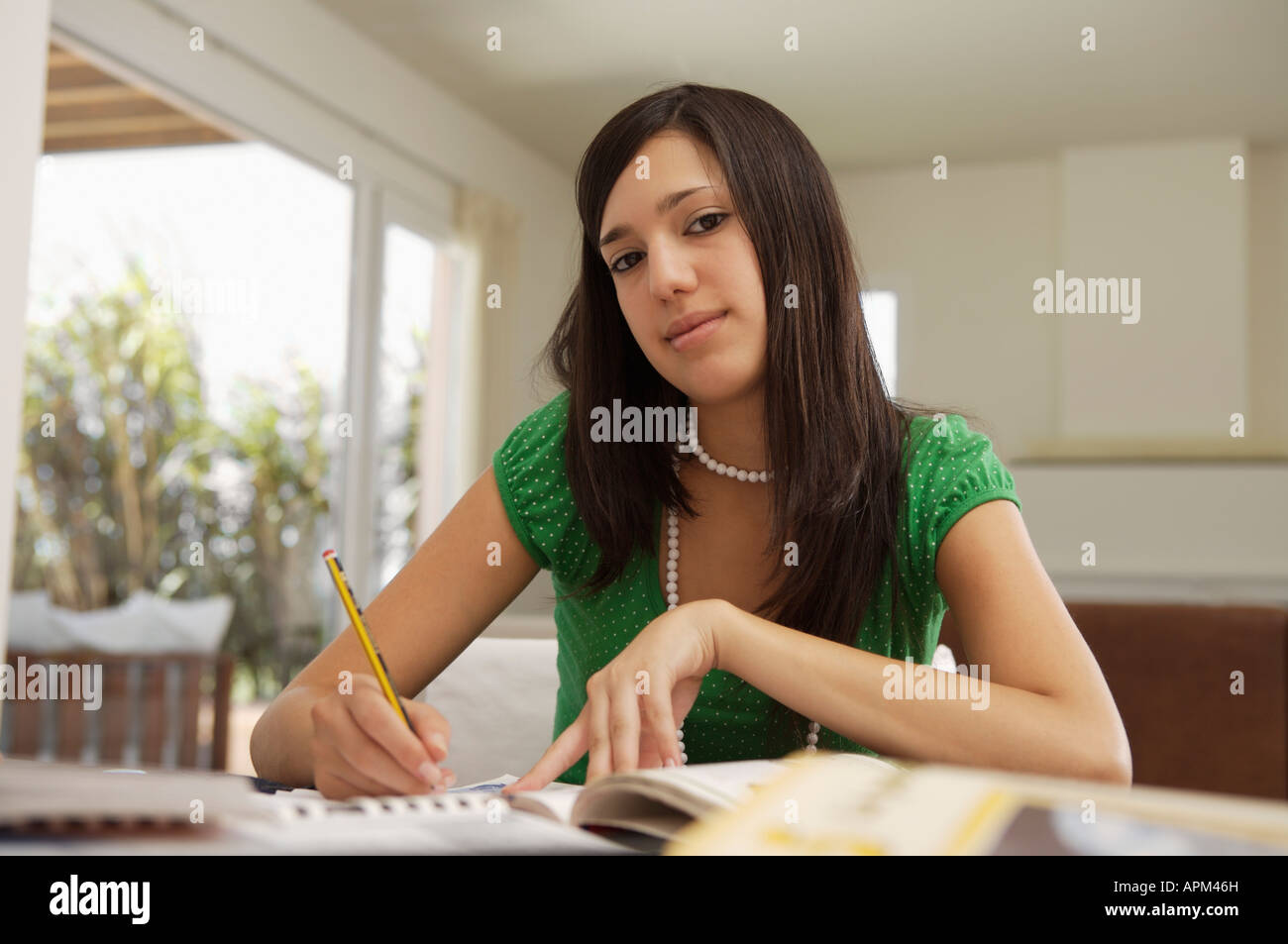 Teenage student doing homework at home Stock Photo - Alamy
