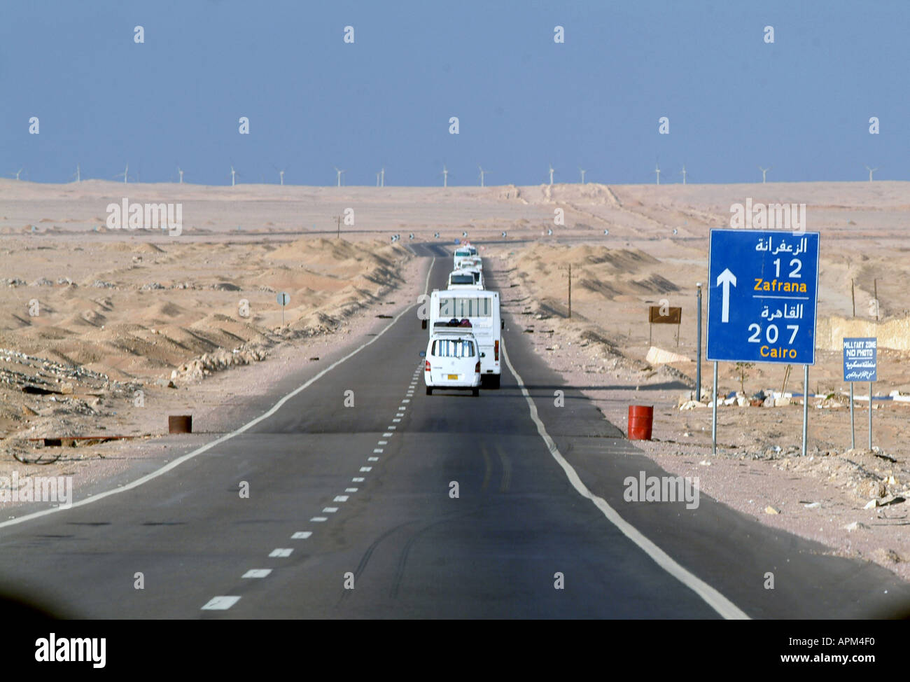Tourist vehicle convoy and road sign to Cairo Egypt Stock Photo - Alamy