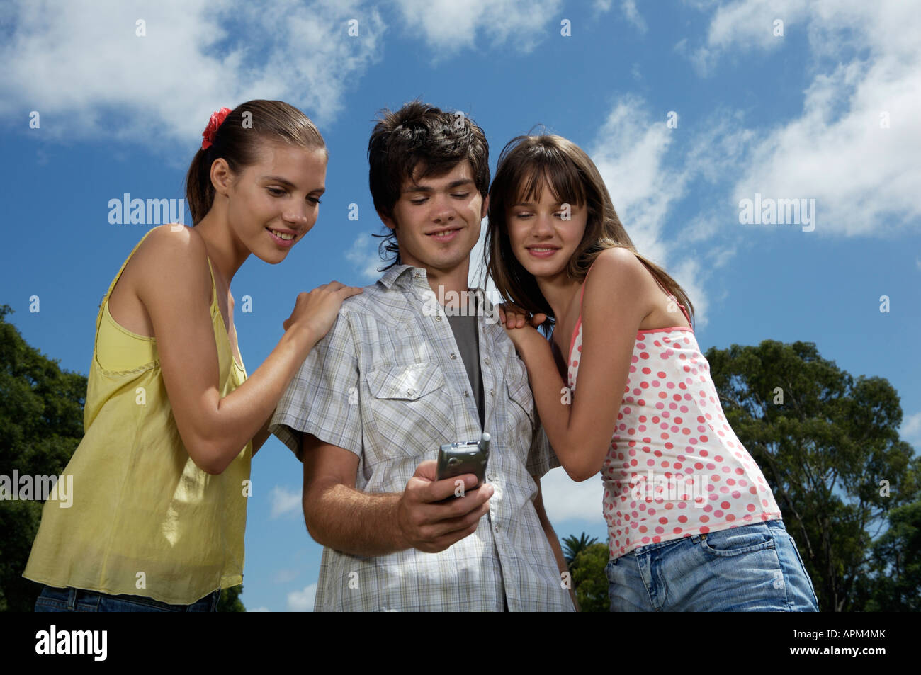 Teenagers using electronic agenda and celullar phone Stock Photo - Alamy