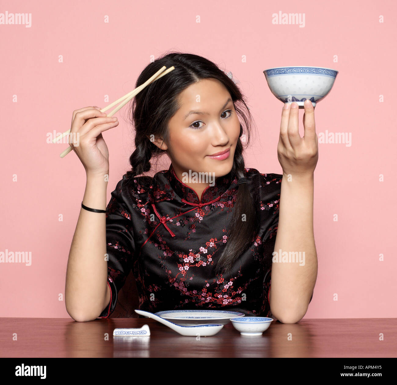 Woman chopsticks sitting smiling braids hi-res stock photography and ...