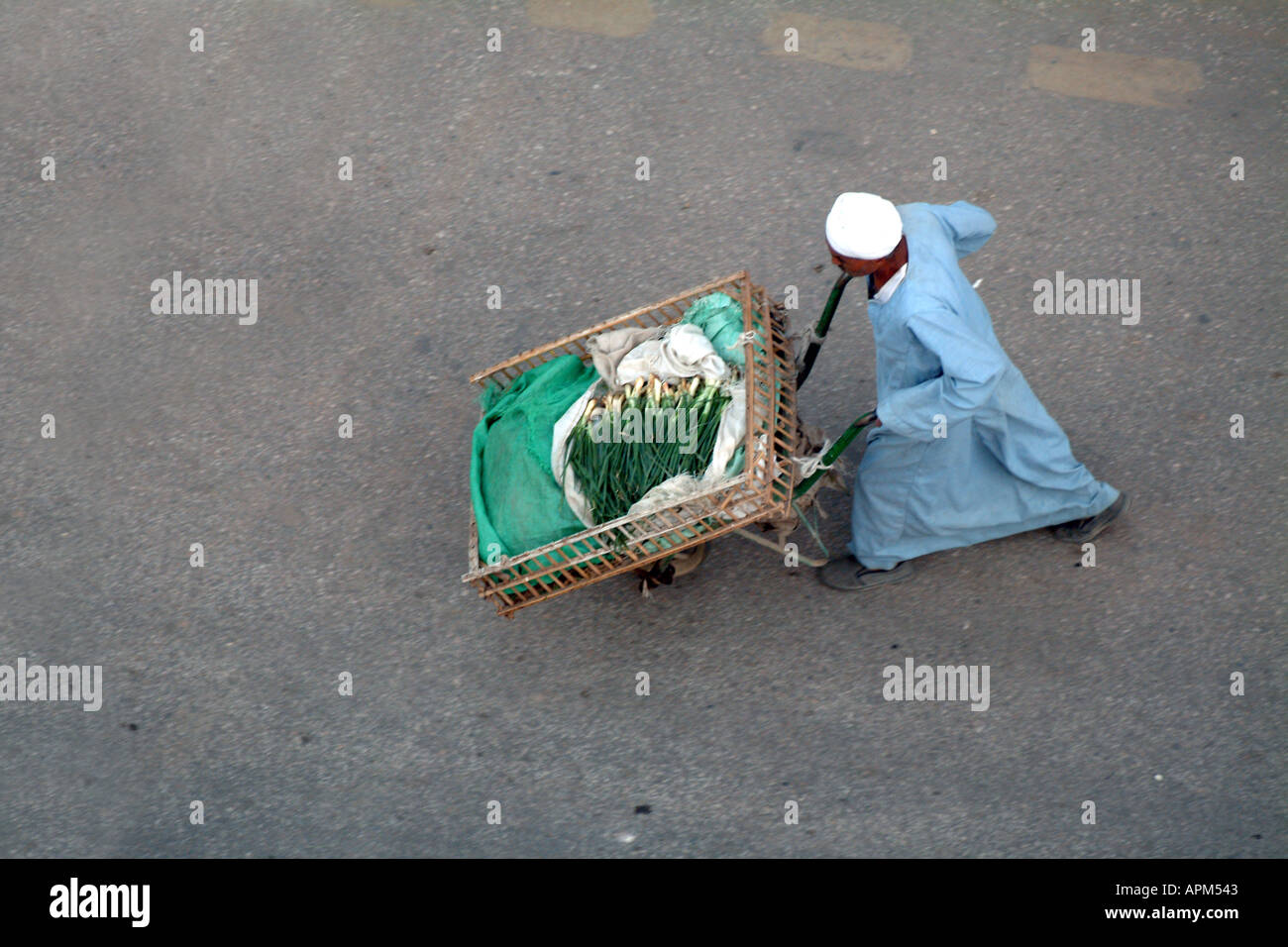 Egyptian man pushing cart laden with vegetables in Luxor Egypt Stock ...