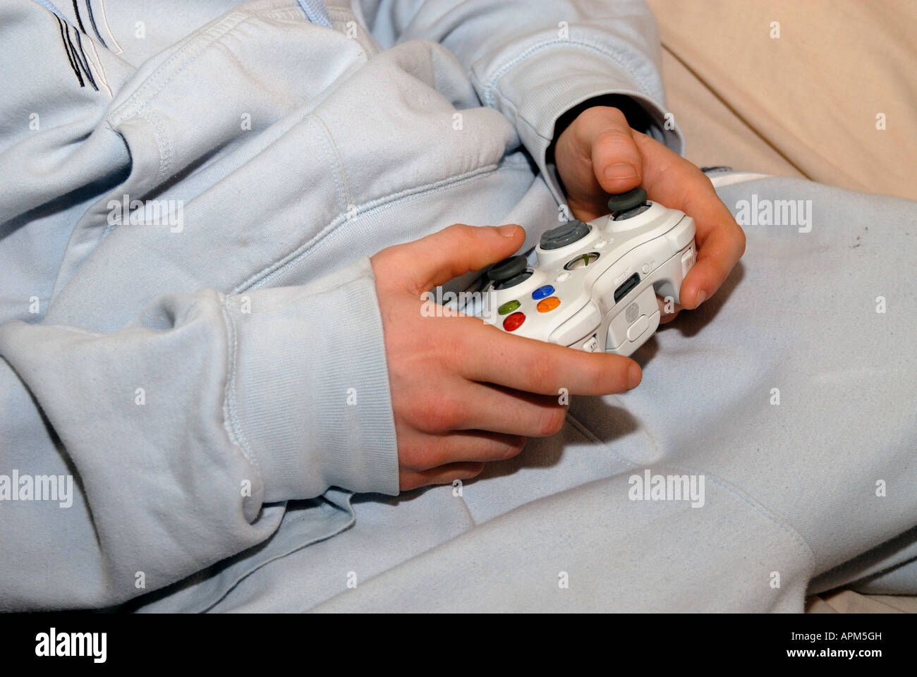 Young boy playing Play Station Stock Photo - Alamy