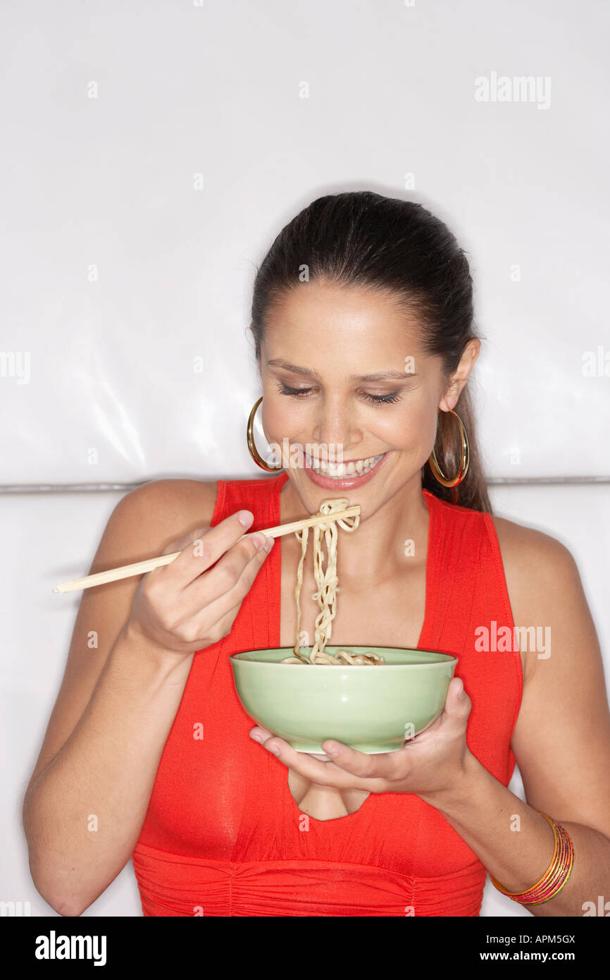 Woman noodles eating hi-res stock photography and images - Alamy