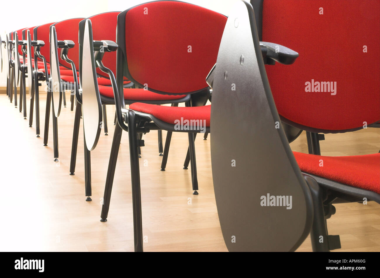 red chairs rows in conference hall Stock Photo - Alamy