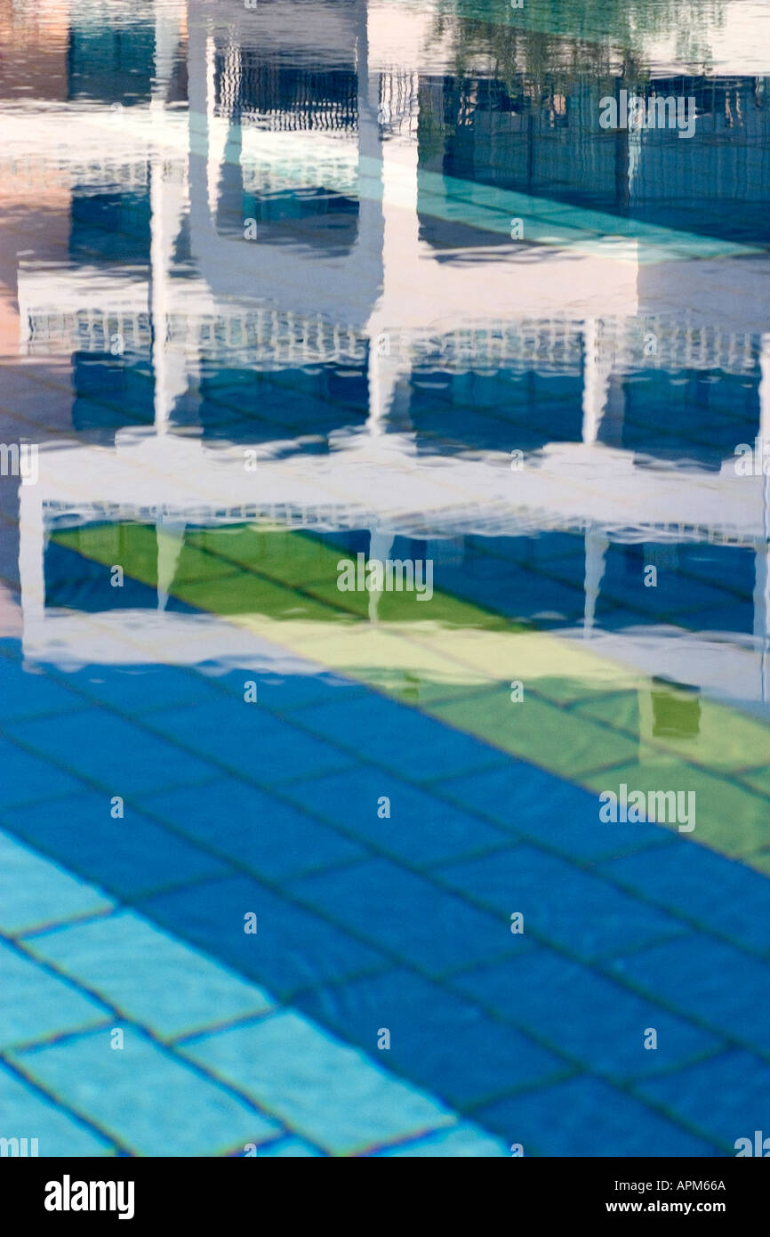 Illusion. Reflections of a hotel in the water of the swimming pool ...